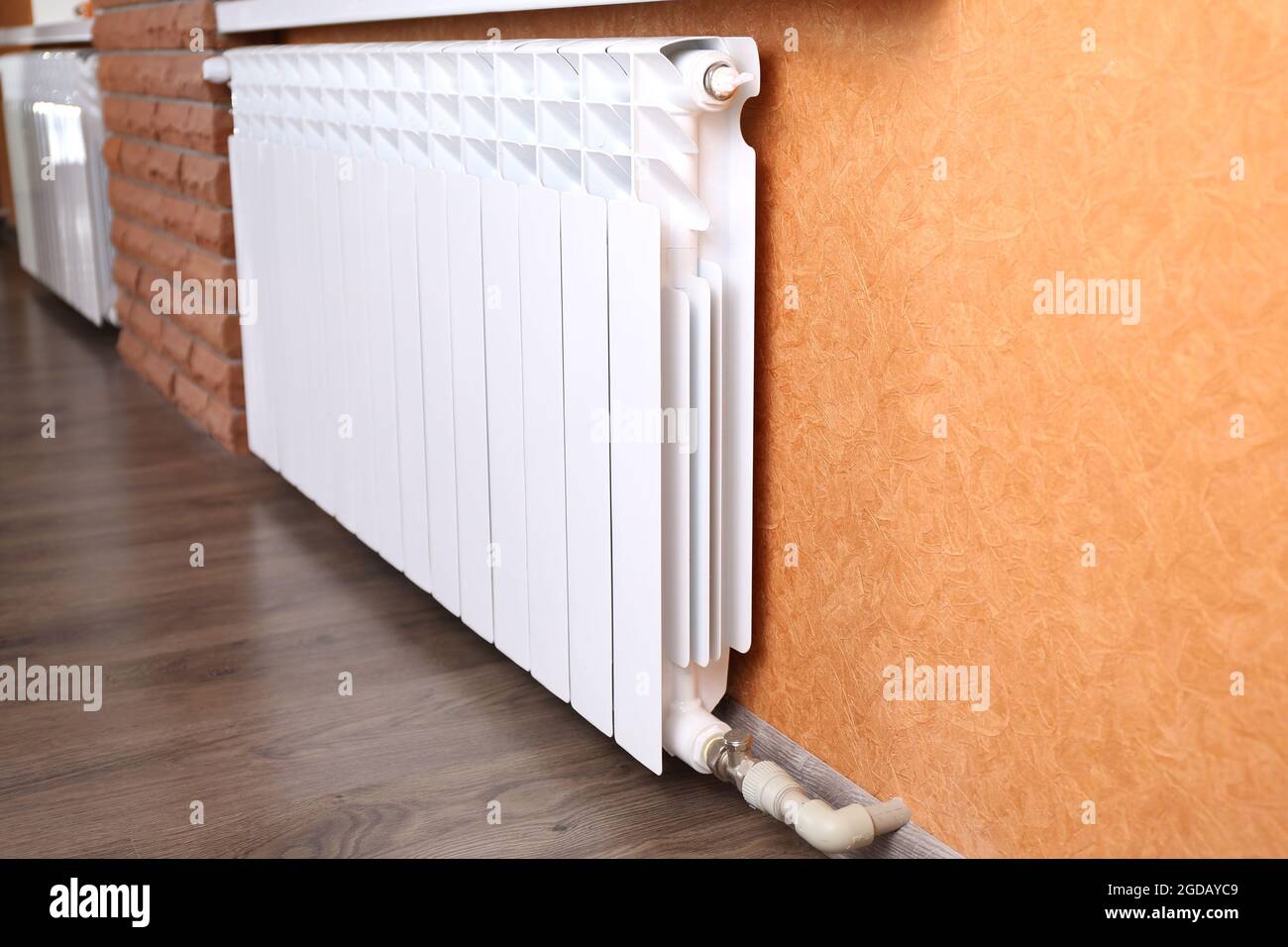 Heating radiator in room Stock Photo - Alamy