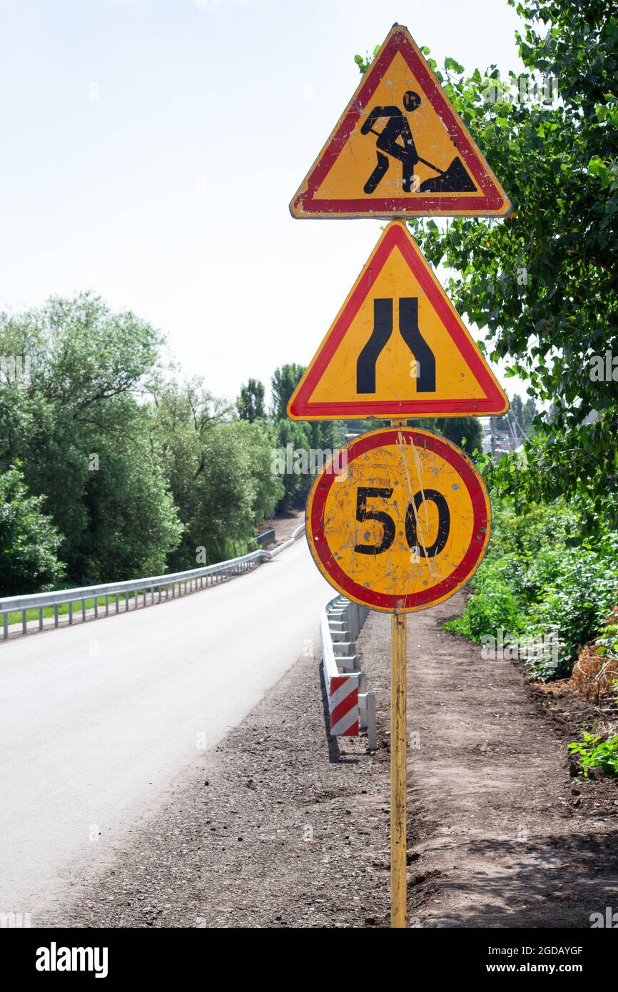 Close-up of old orange peeling sign in very rough condition. Speed ...