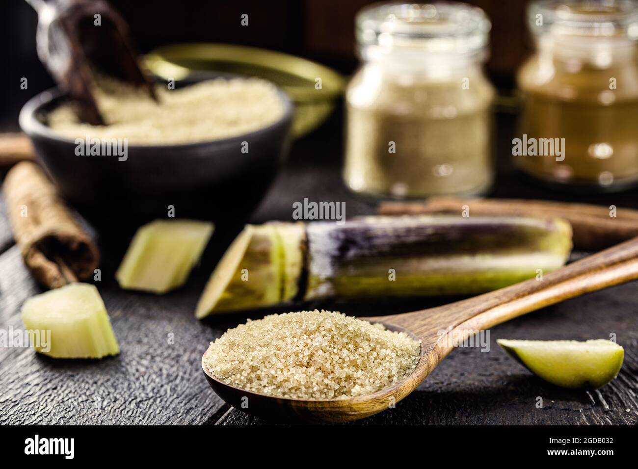 wooden spoon with pure sugar straight from sugar cane, organic product ...