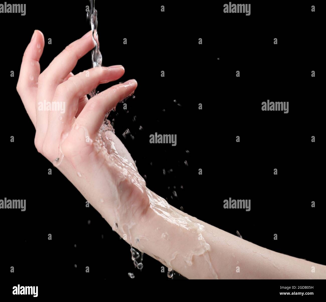 Human hand with water splashing on them on black background Stock Photo ...