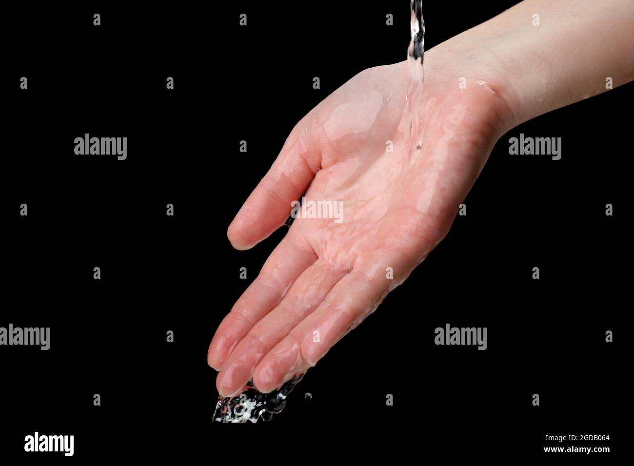 Human hand with water splashing on them on black background Stock Photo ...