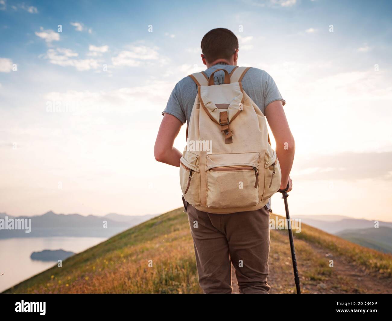 Young man travels alone walking on trail and enjoying on view of ...