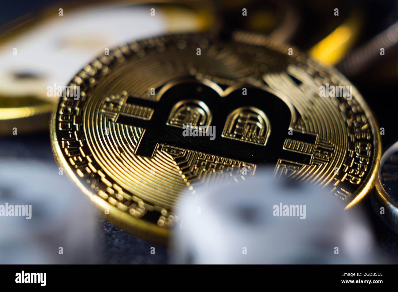 Coin with the Bitcoin on it on a blurred background Stock Photo - Alamy