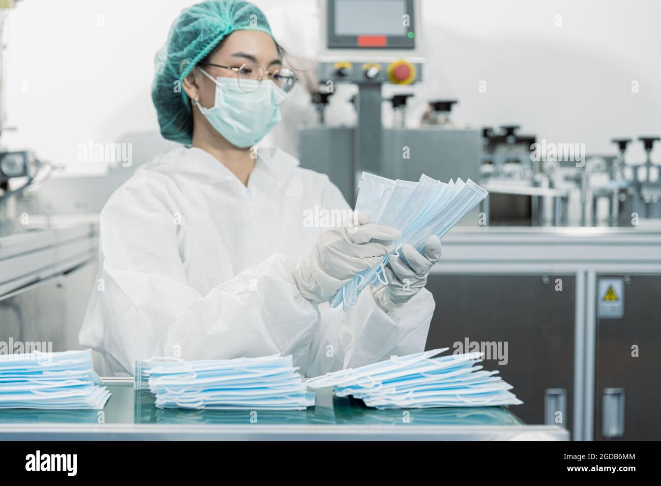 Women worker working in disposal face mask factory in china Stock Photo ...