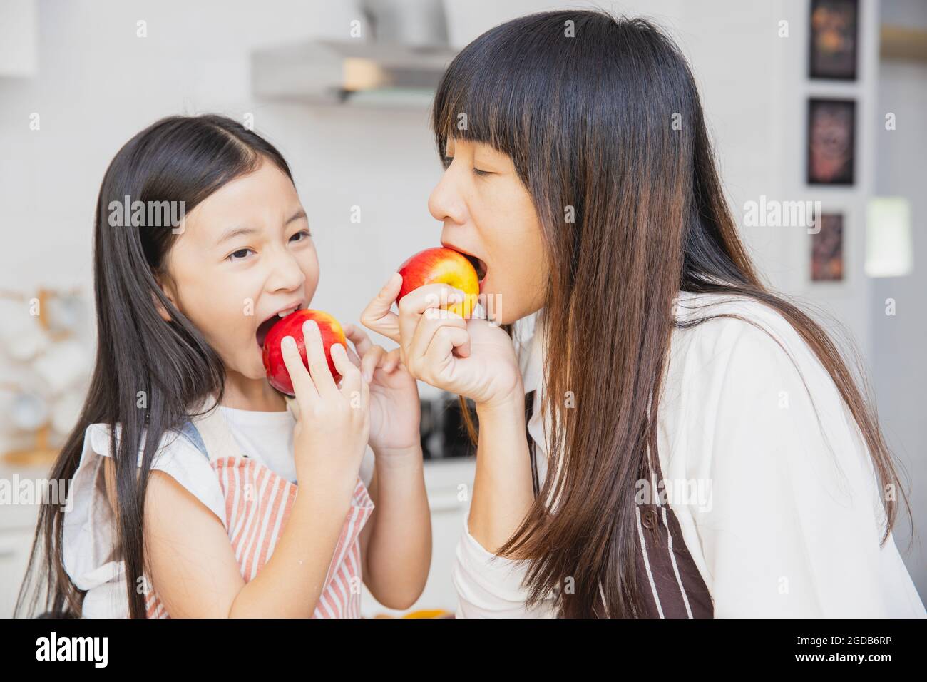 People enjoy eating apple fruits for healthy lifestyle at home with ...