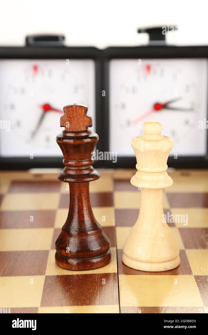 Chessboard with chess and clock, isolated on white Stock Photo - Alamy