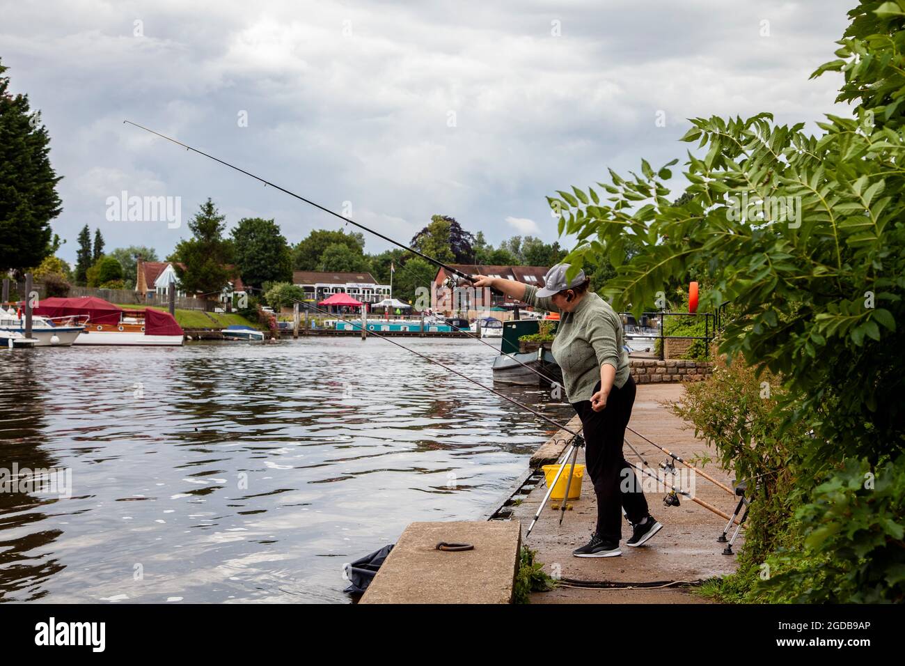 A woman fishing on the Thames in Shepperton Stock Photo - Alamy