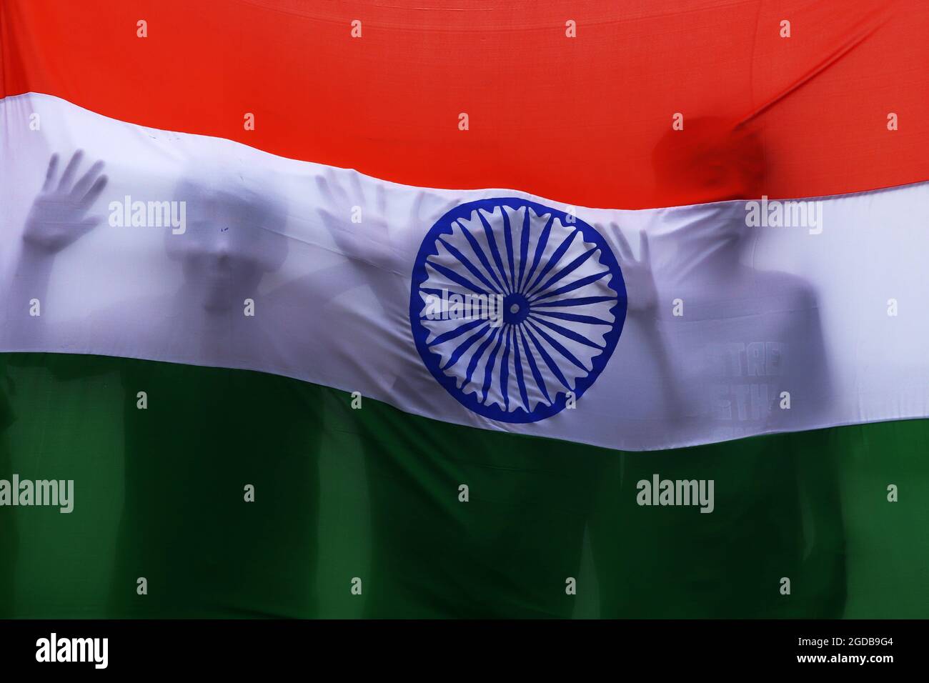 Chennai, Tamil Nadu, India. 12th Aug, 2021. Children silhouetted ...