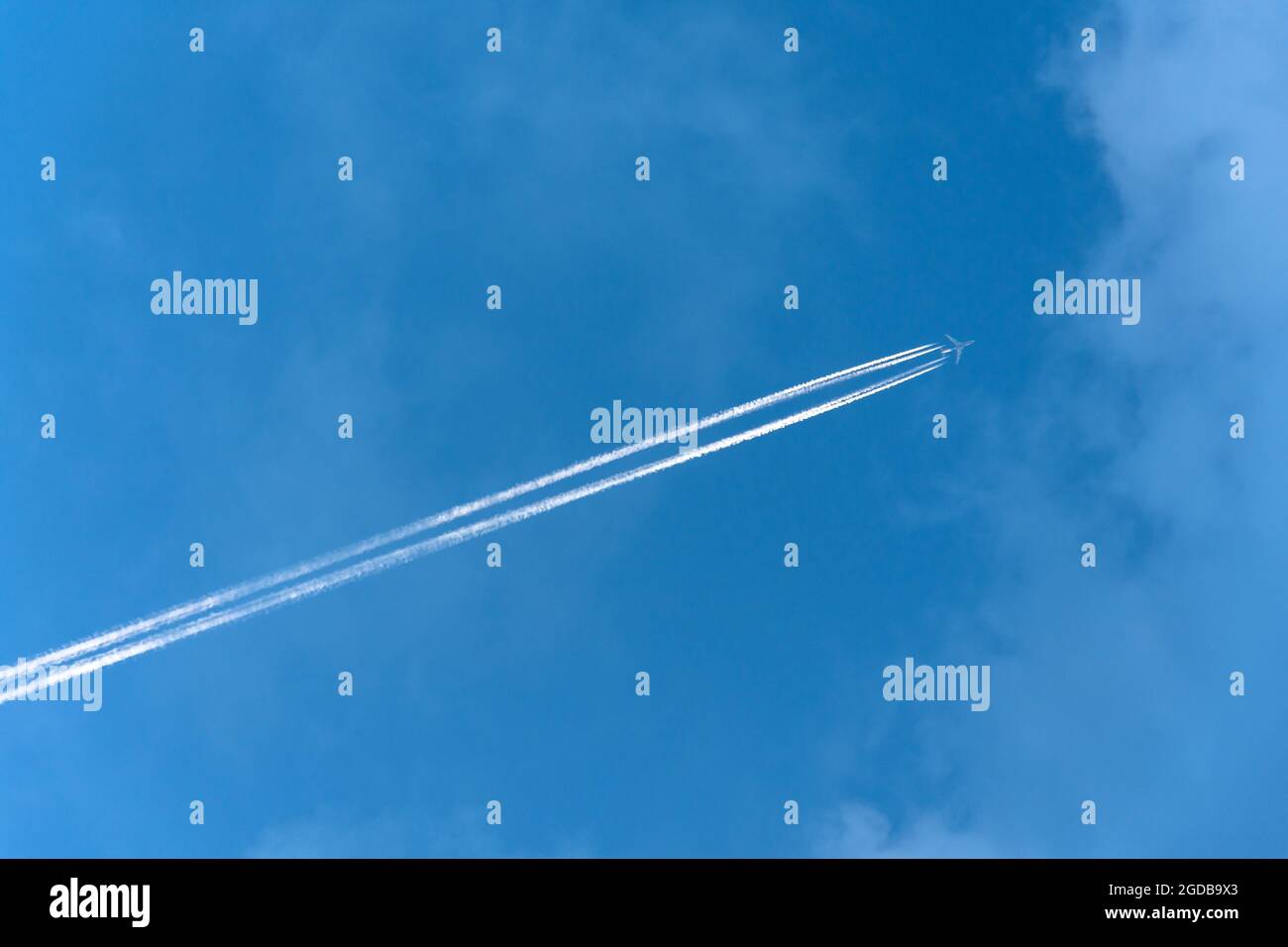 White aircraft big two engines aviation airport contrail clouds Stock ...