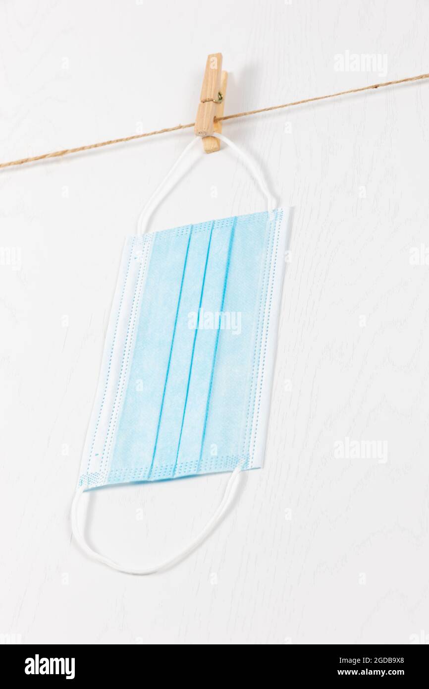 Protective mask against bacteria hangs hi-res stock photography and ...