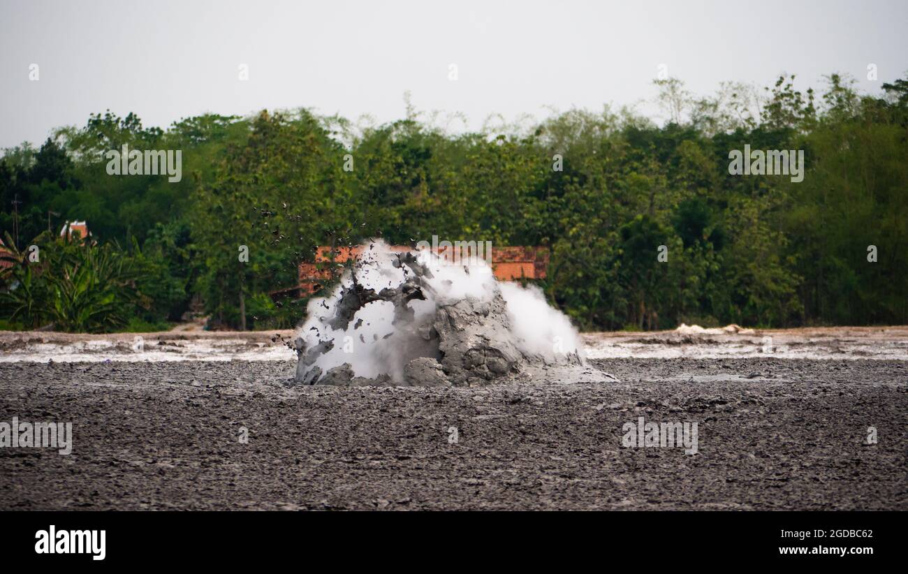 mud volcano with bursting bubble bledug kuwu. volcanic plateau with ...