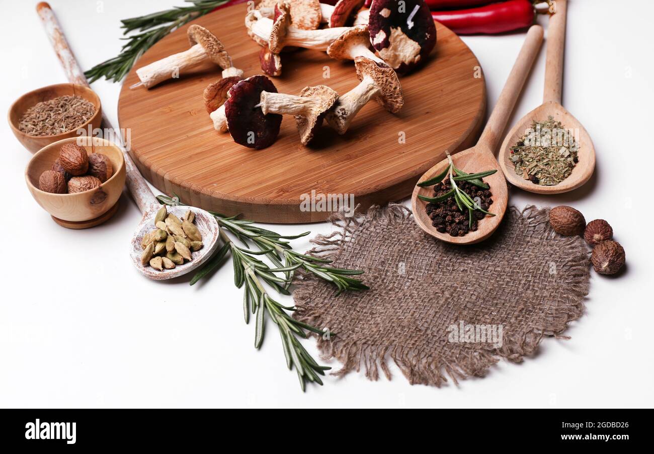 Different spices and cutting board, isolated on white Stock Photo - Alamy