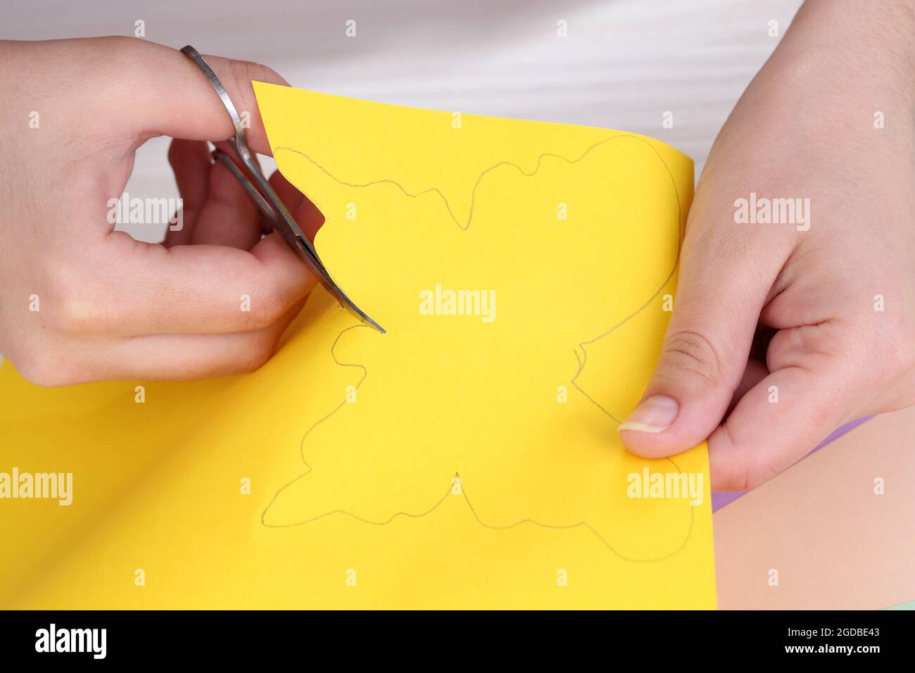 Women hand cutting colorful paper with scissors Stock Photo - Alamy