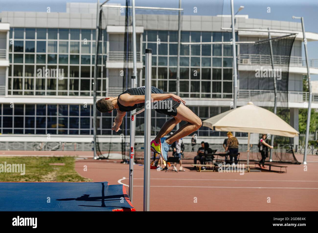 high jump male athlete successful attempt at competition Stock Photo ...