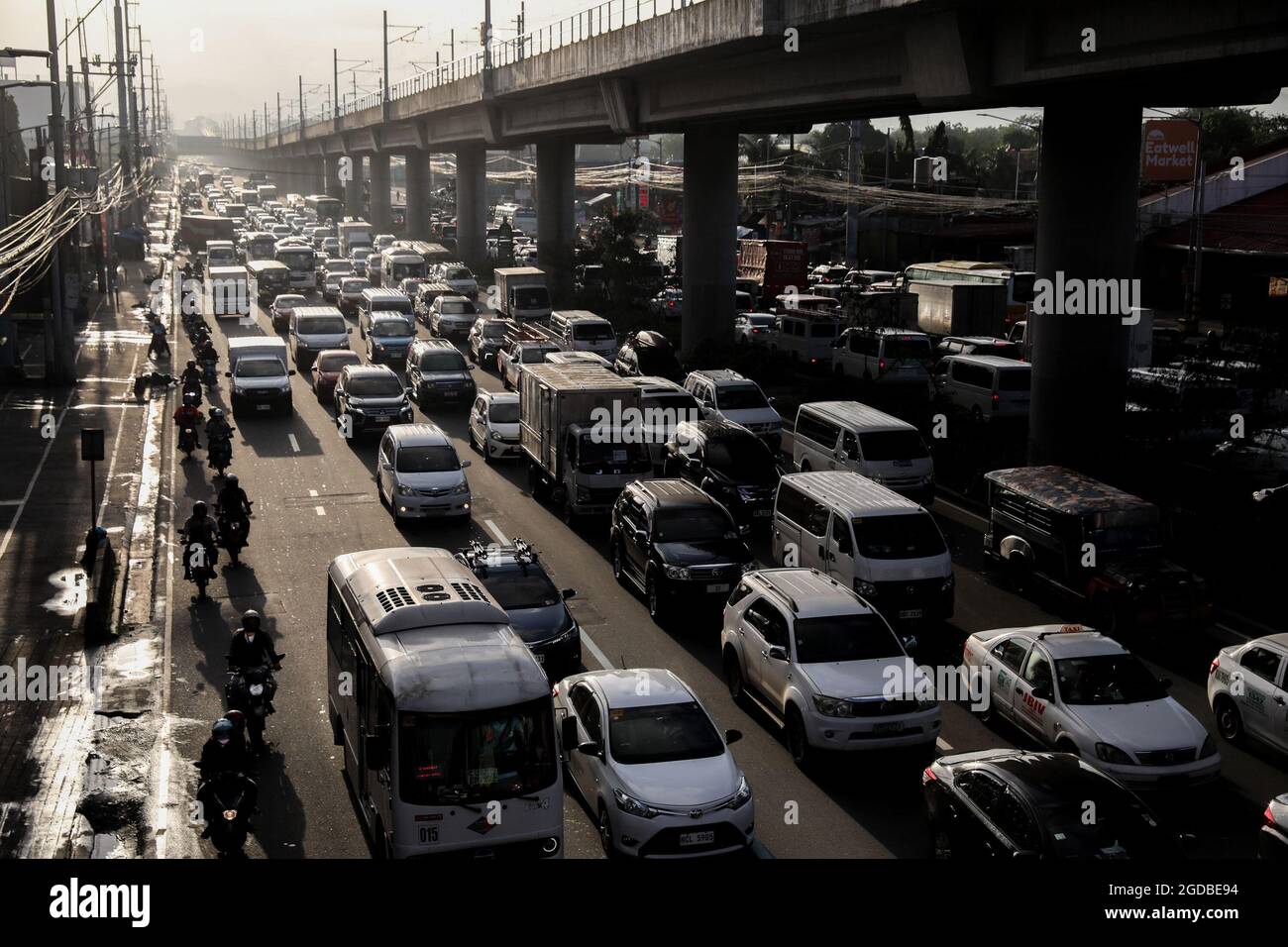 Policemen wearing protective equipment inspect motorcycle riders at a ...