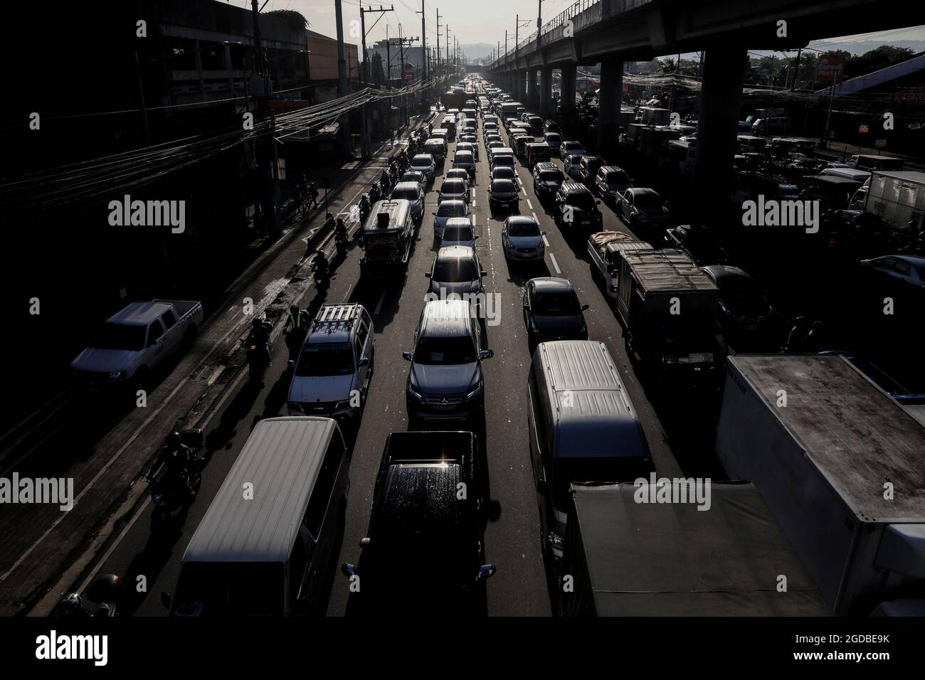 Policemen wearing protective equipment inspect motorcycle riders at a ...