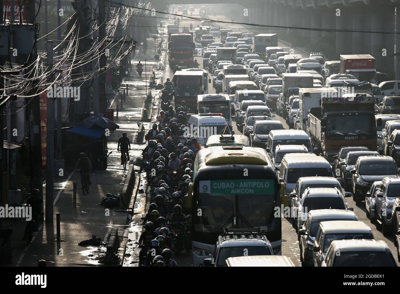 Policemen wearing protective equipment inspect motorcycle riders at a ...
