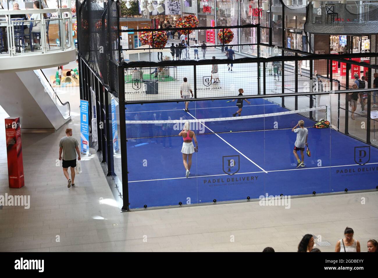 Some who play paddle tennis on a paddle tennis court in the shopping ...