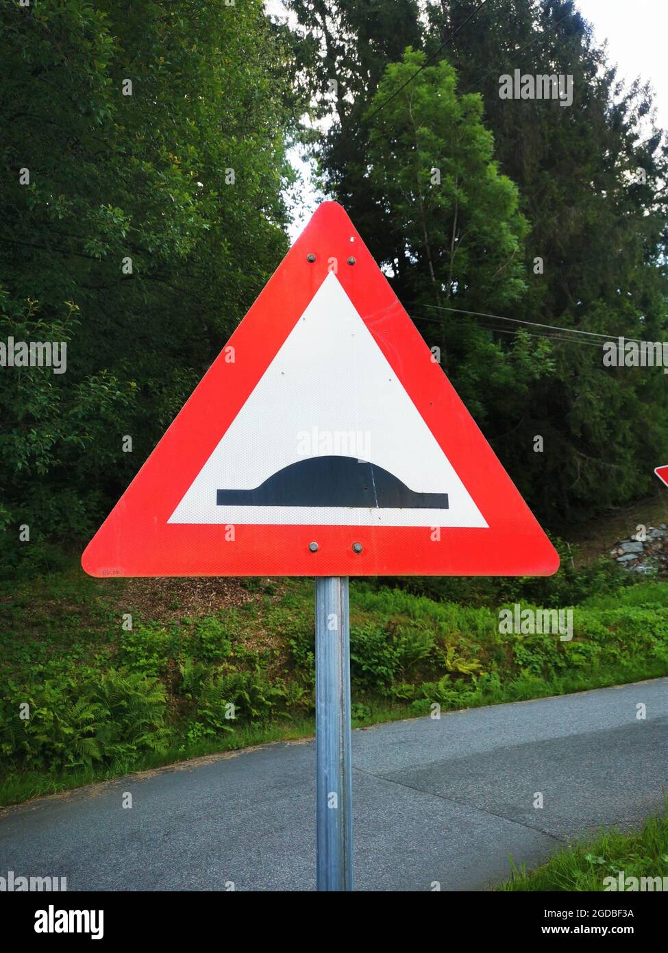 Street traffic sign of a hump traffic Stock Photo - Alamy