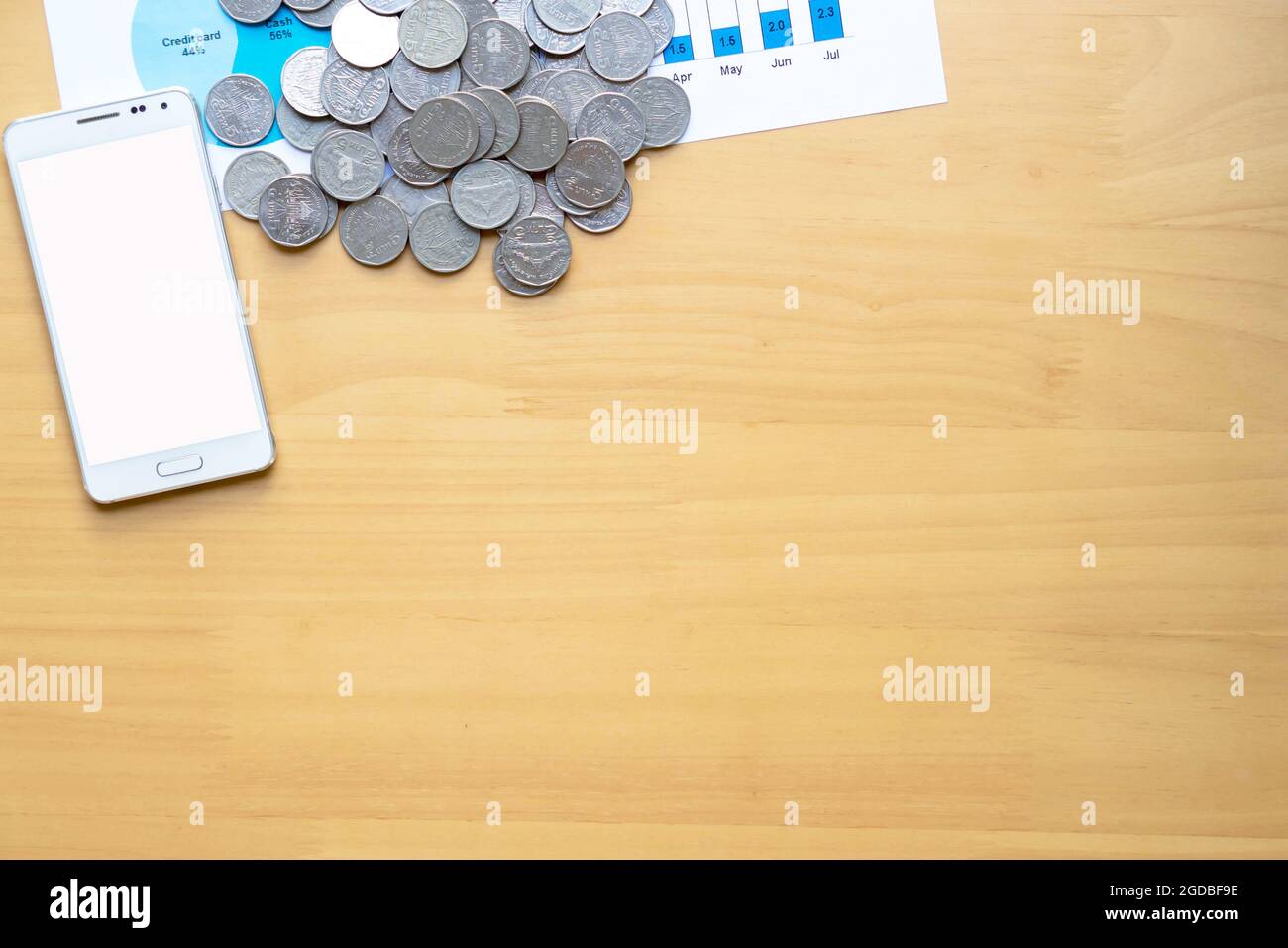 Mobile smart phone and graph report Stock Photo - Alamy