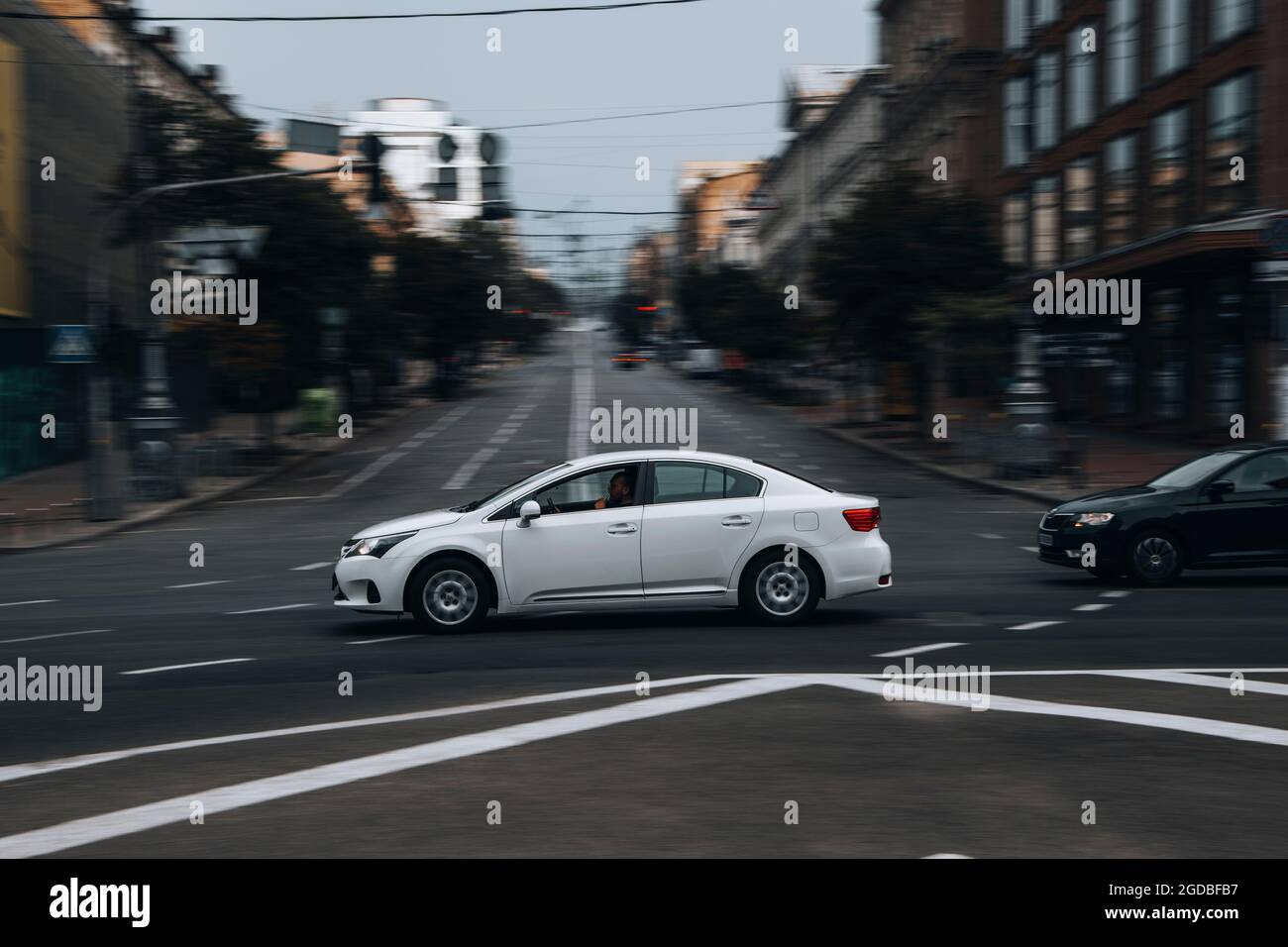 Ukraine, Kyiv - 2 June 2021: White Toyota Avensis car moving on the ...
