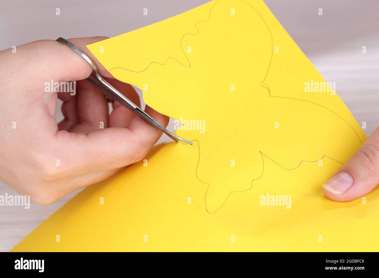 Women hand cutting colorful paper with scissors Stock Photo - Alamy