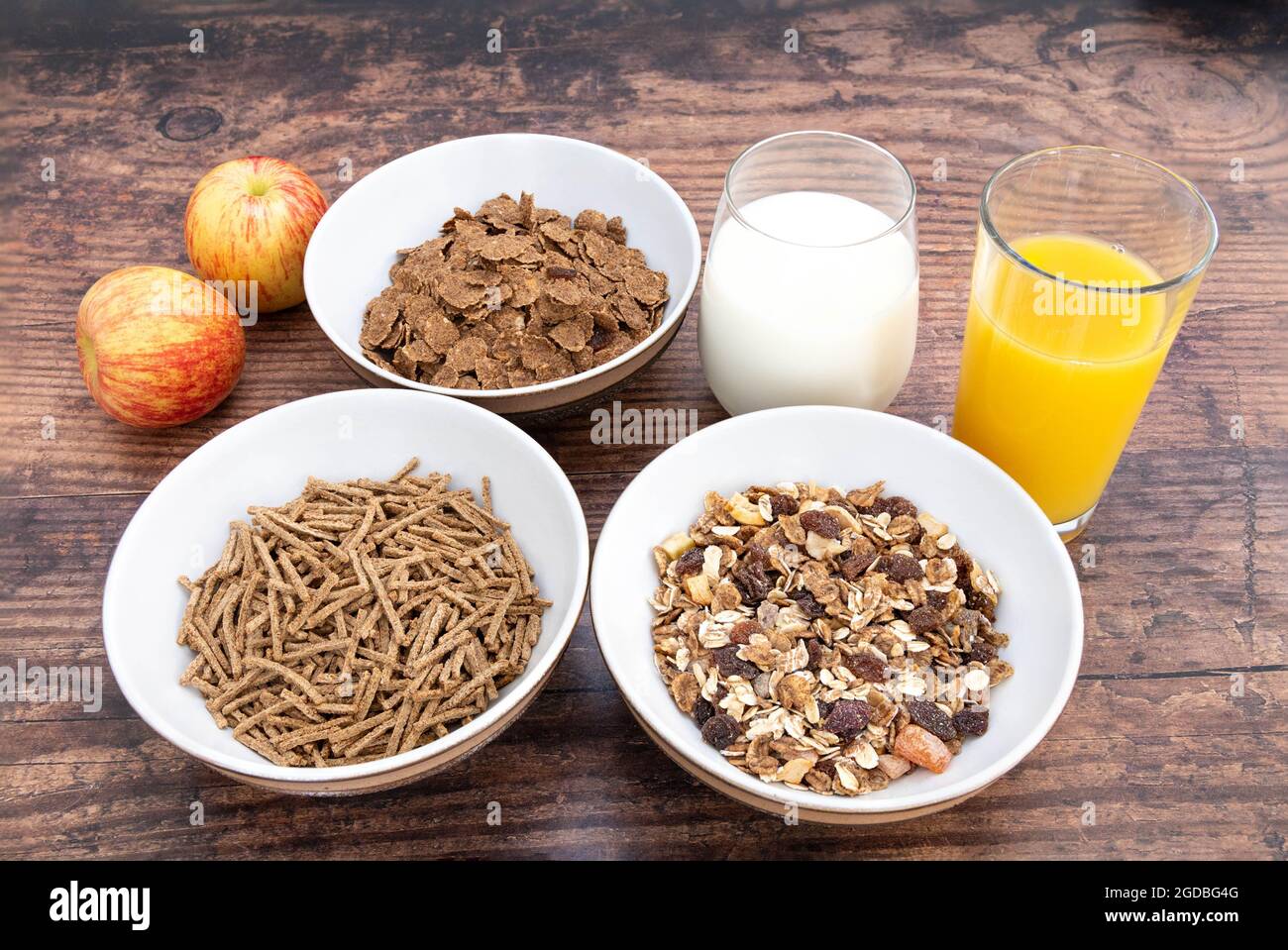Image of Milk and Orange juice, bowls os serial including muesli bran ...