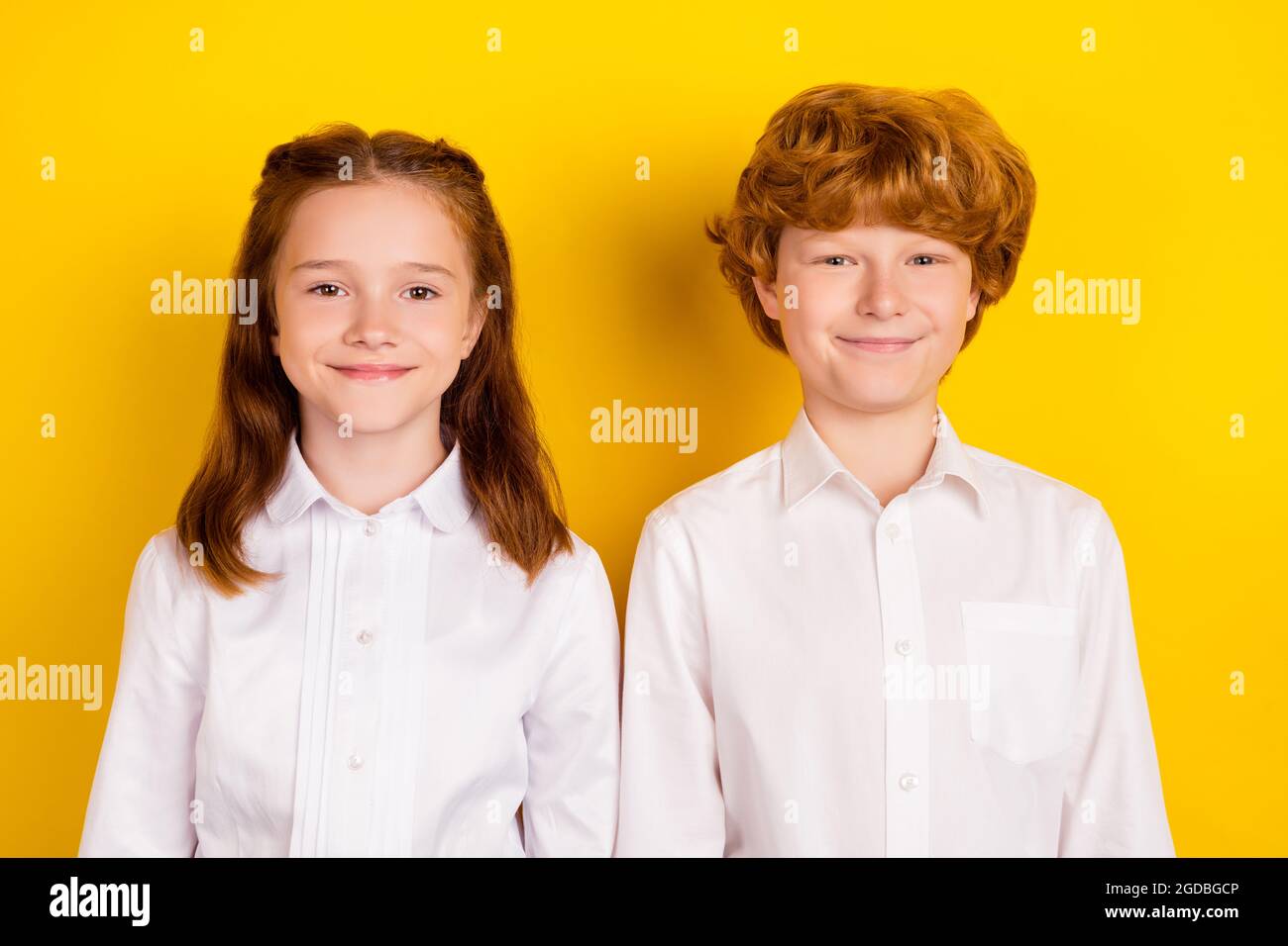 Photo of young lovely pretty smiling first-graders pupils go to school ...