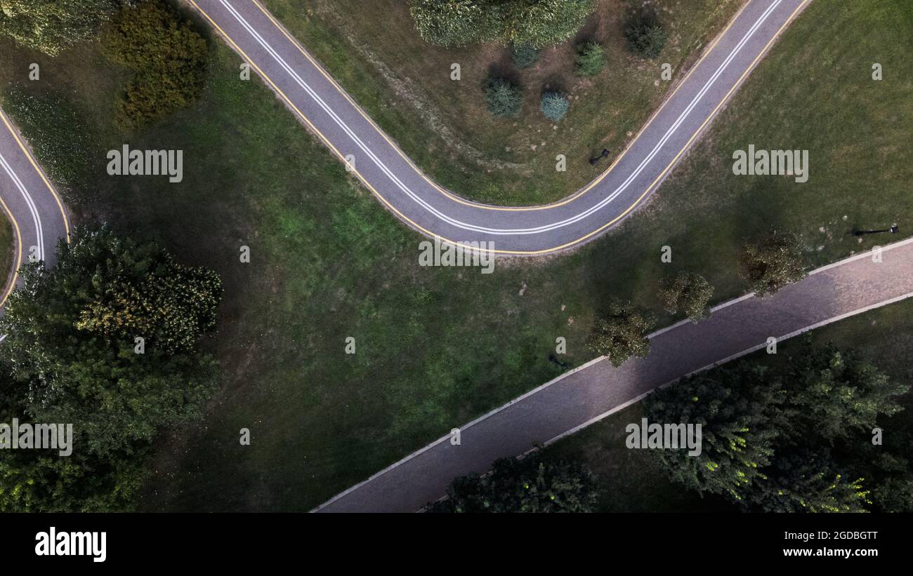 Road winds among trees hi-res stock photography and images - Alamy