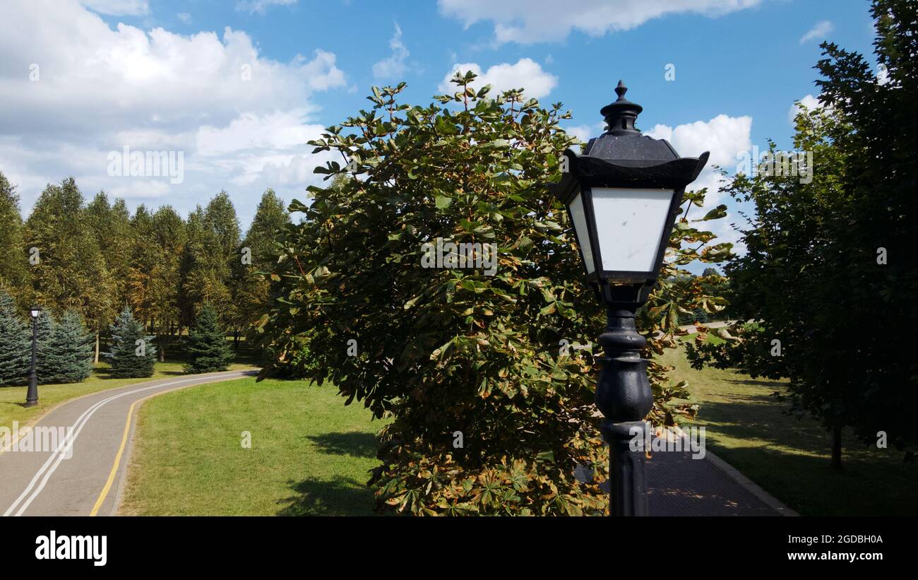 A winding bike path in the park. Winds among trees and bushes. Aerial ...