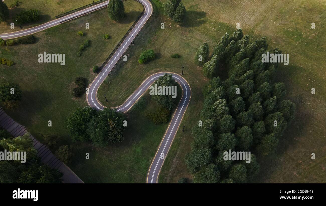 Road winds among trees hi-res stock photography and images - Alamy
