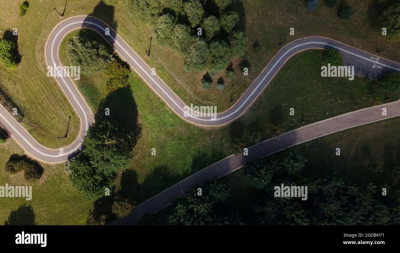Road winds among trees hi-res stock photography and images - Alamy