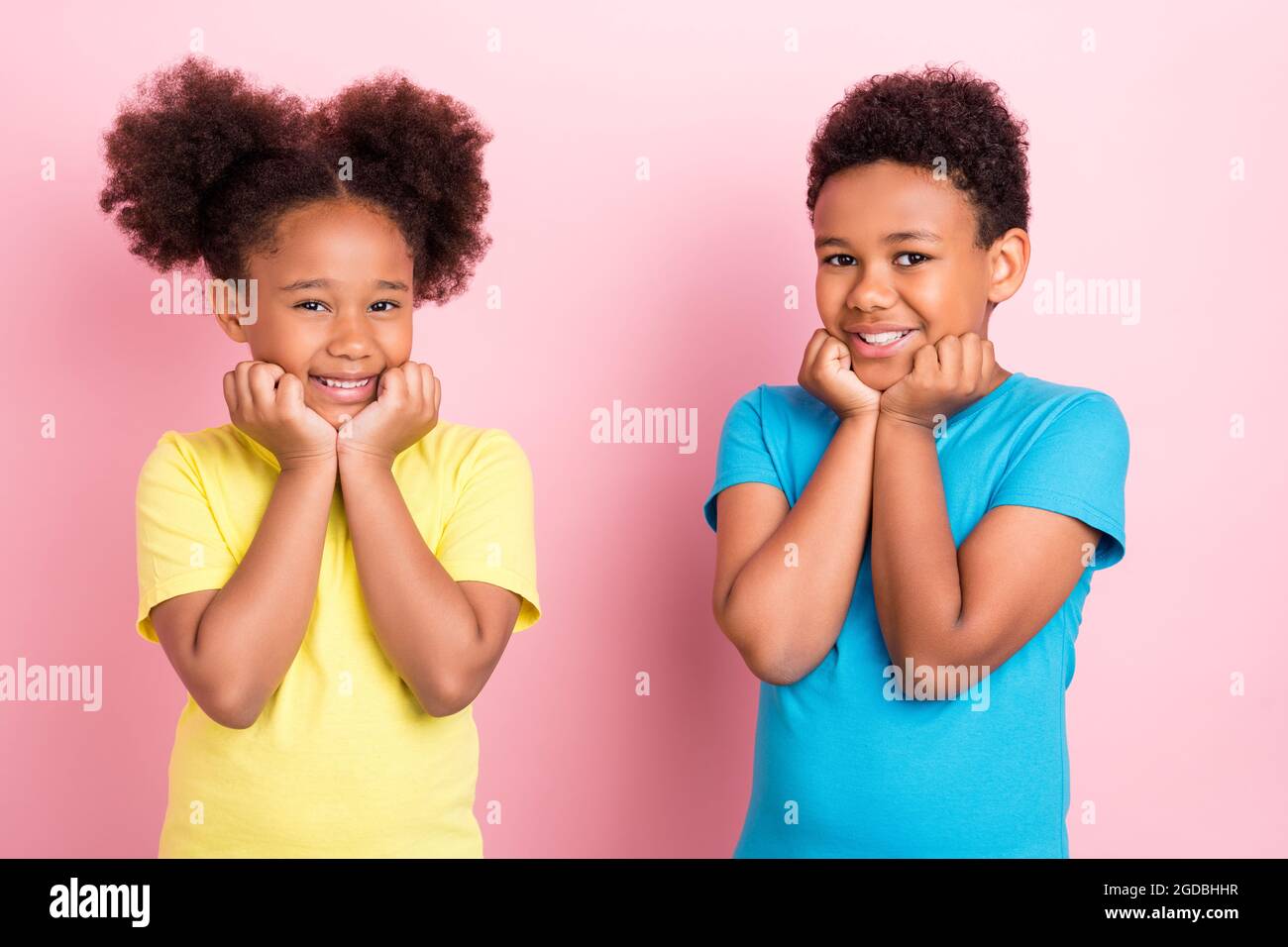 Portrait of two attractive cheerful friends enjoying good mood isolated ...