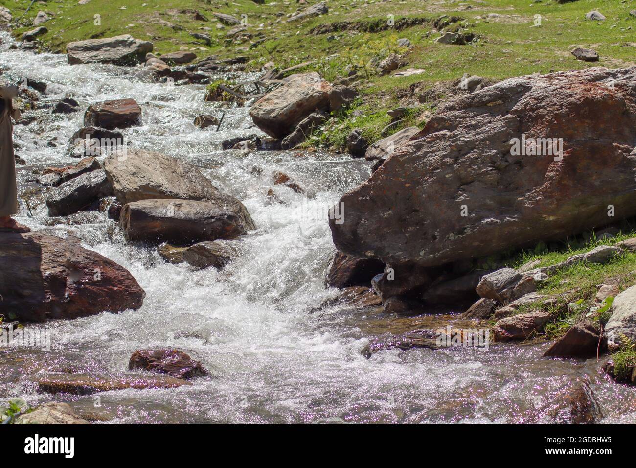 Natural view of the water flowing on a rocky river in the countryside ...