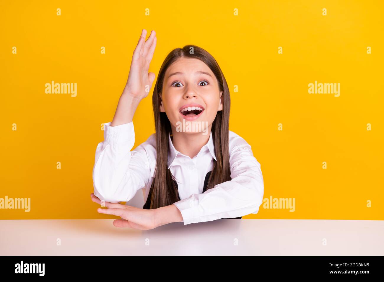 Photo of little impressed girl study wear white shirt isolated on ...