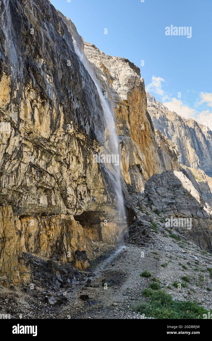 Waterfall fed from Stanley Glacier, tumbles from cliff face on side of ...