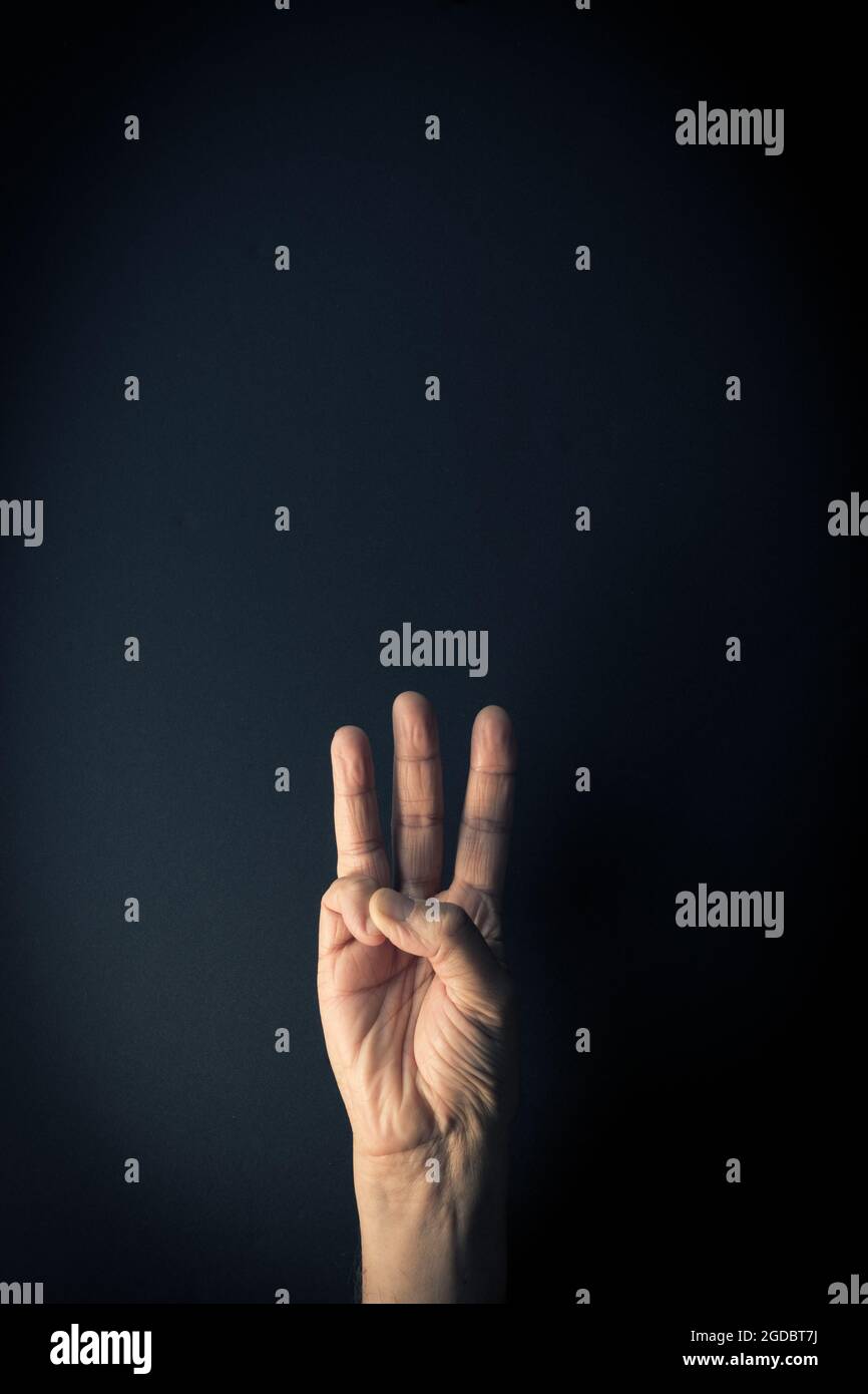 Three finger hand gesture sign hi-res stock photography and images - Alamy