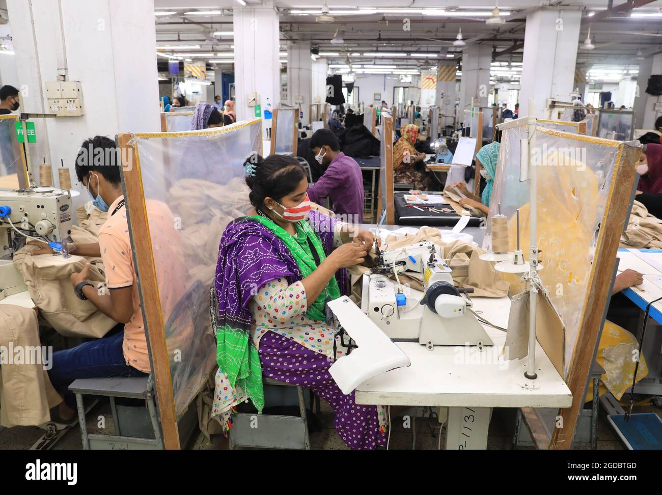 August 12, 2021,Dhaka,Bangladesh: Garment workers work at a factory ...