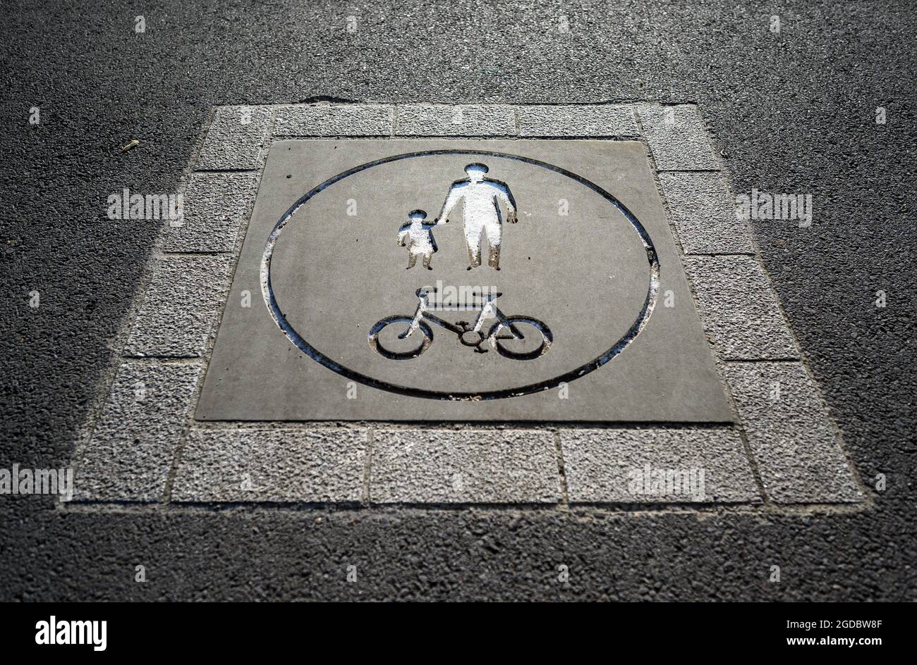 Sign set in a path indicating that it is a shared footpath and cycle ...