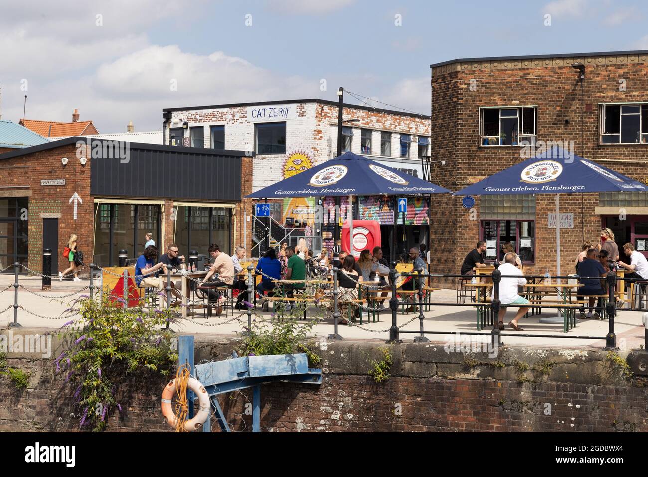 Hull Waterfront; people sitting drinking in cafes and outside in the ...