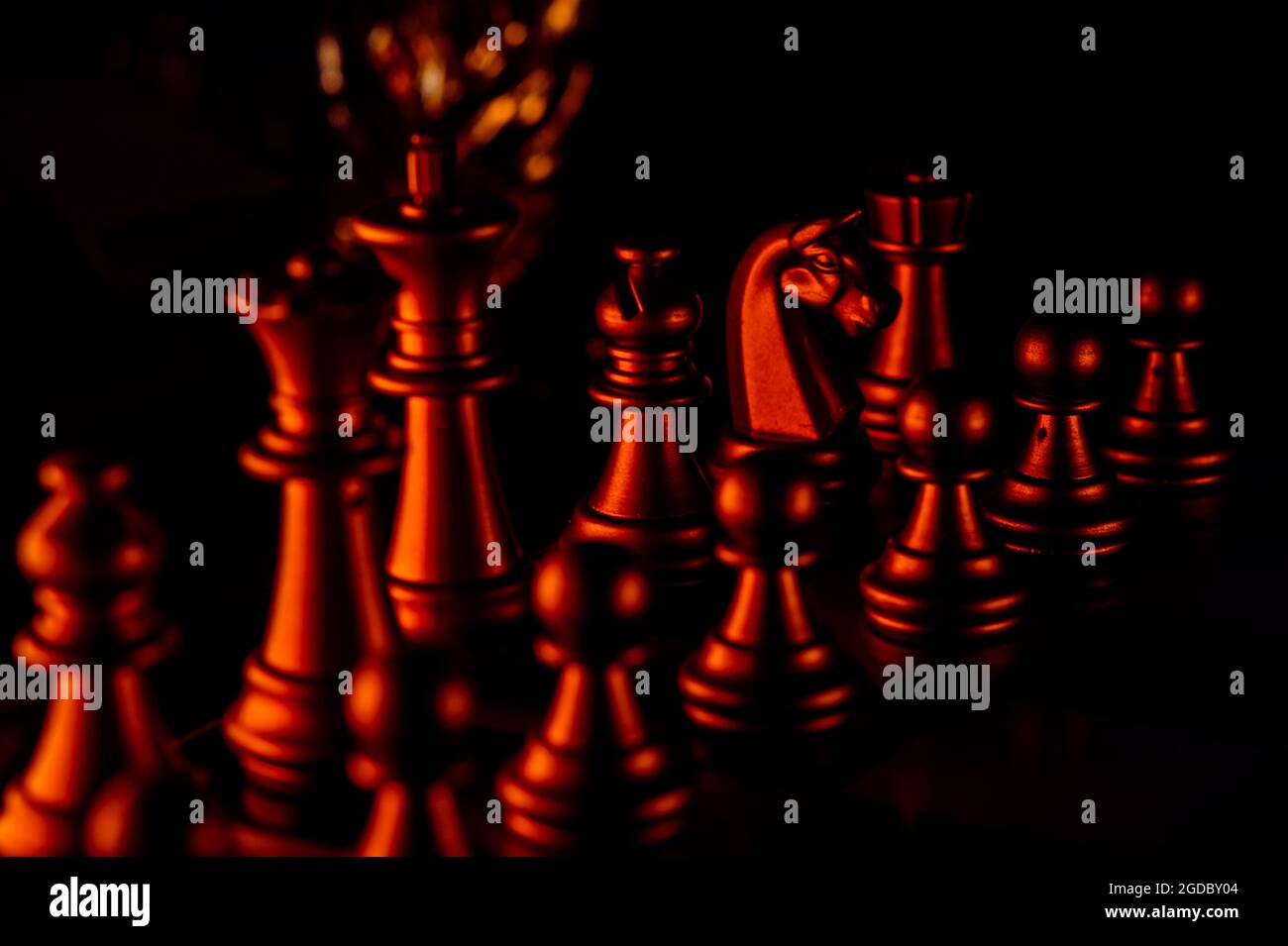 Chess pieces on the board on a dark background Stock Photo - Alamy