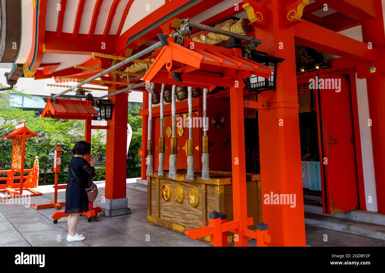Women silently praying at a shrine in the suburbs of Tokyo, Japan Stock ...