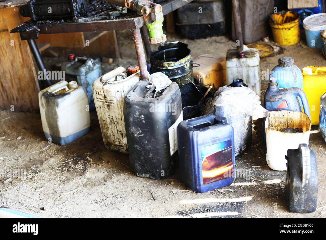 Stack of rusted metallic car parts and tools in garage Stock Photo - Alamy