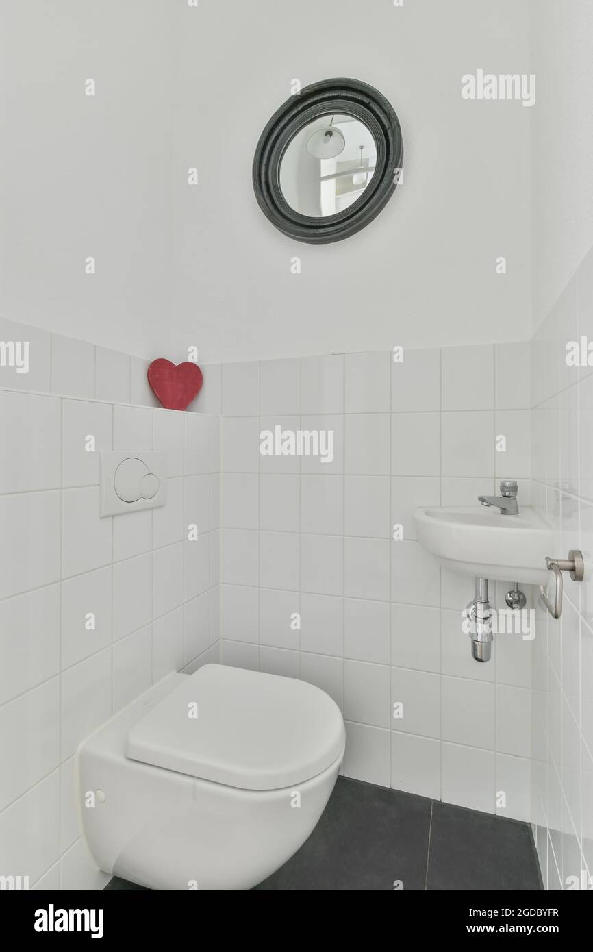 Interior of small clean washroom in miniature style Stock Photo - Alamy