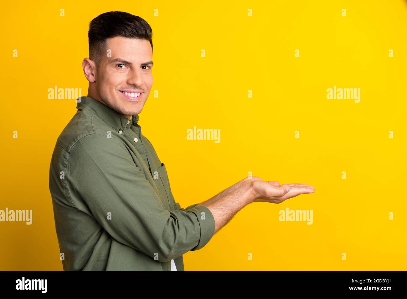 Photo portrait man smiling keeping copyspace on hands isolated vivid ...