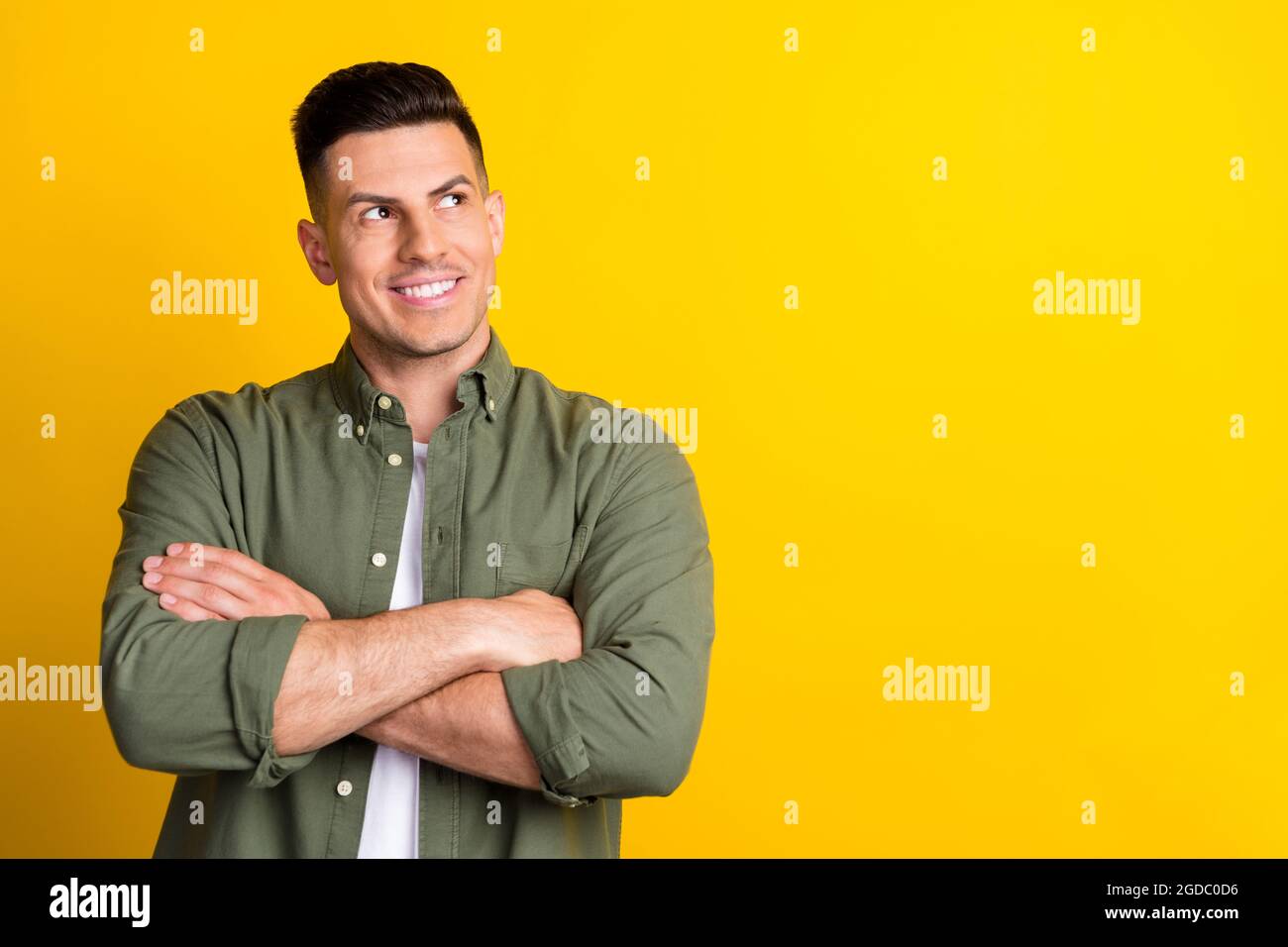 Photo of young man happy positive smile folded hands dream look empty ...