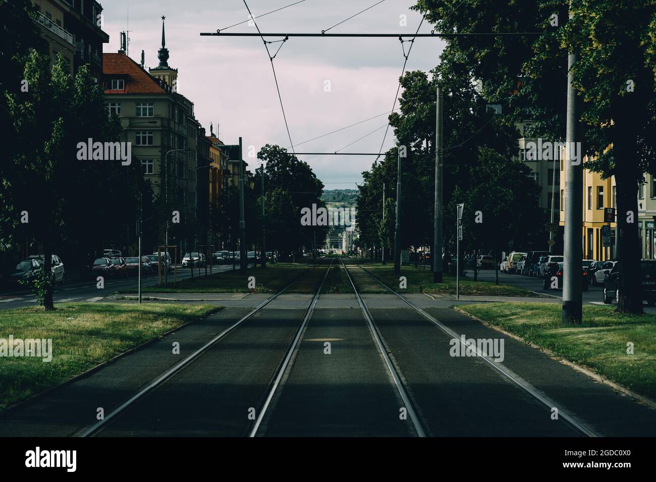 Tram railway track in the city against a cloudy sky Stock Photo - Alamy