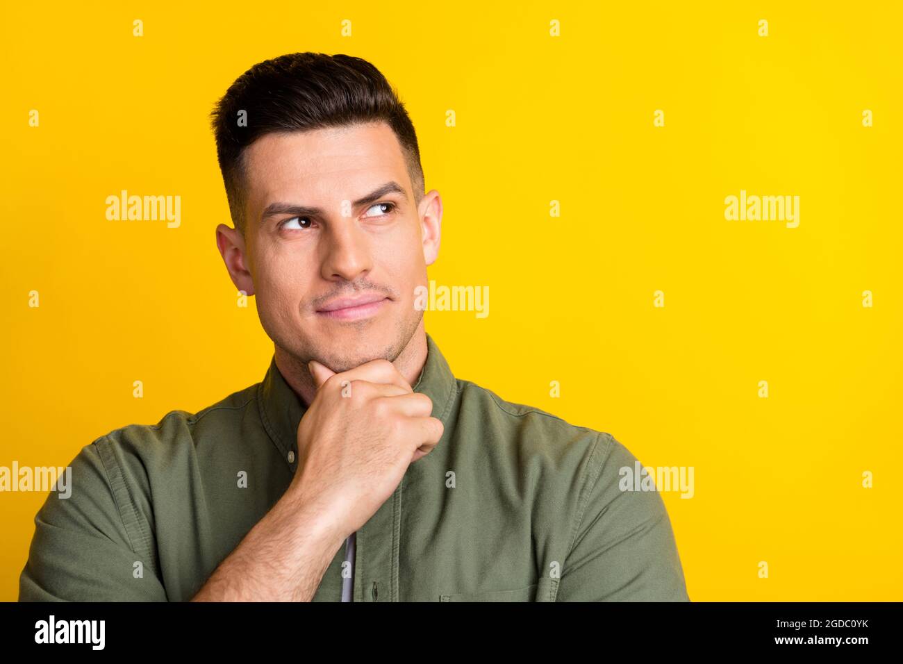 Photo of young handsome man hand touch chin think curious look empty ...