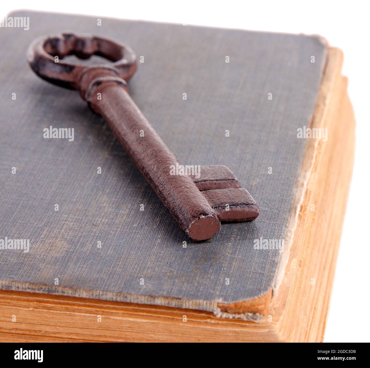 Old key on old book isolated on white Stock Photo - Alamy