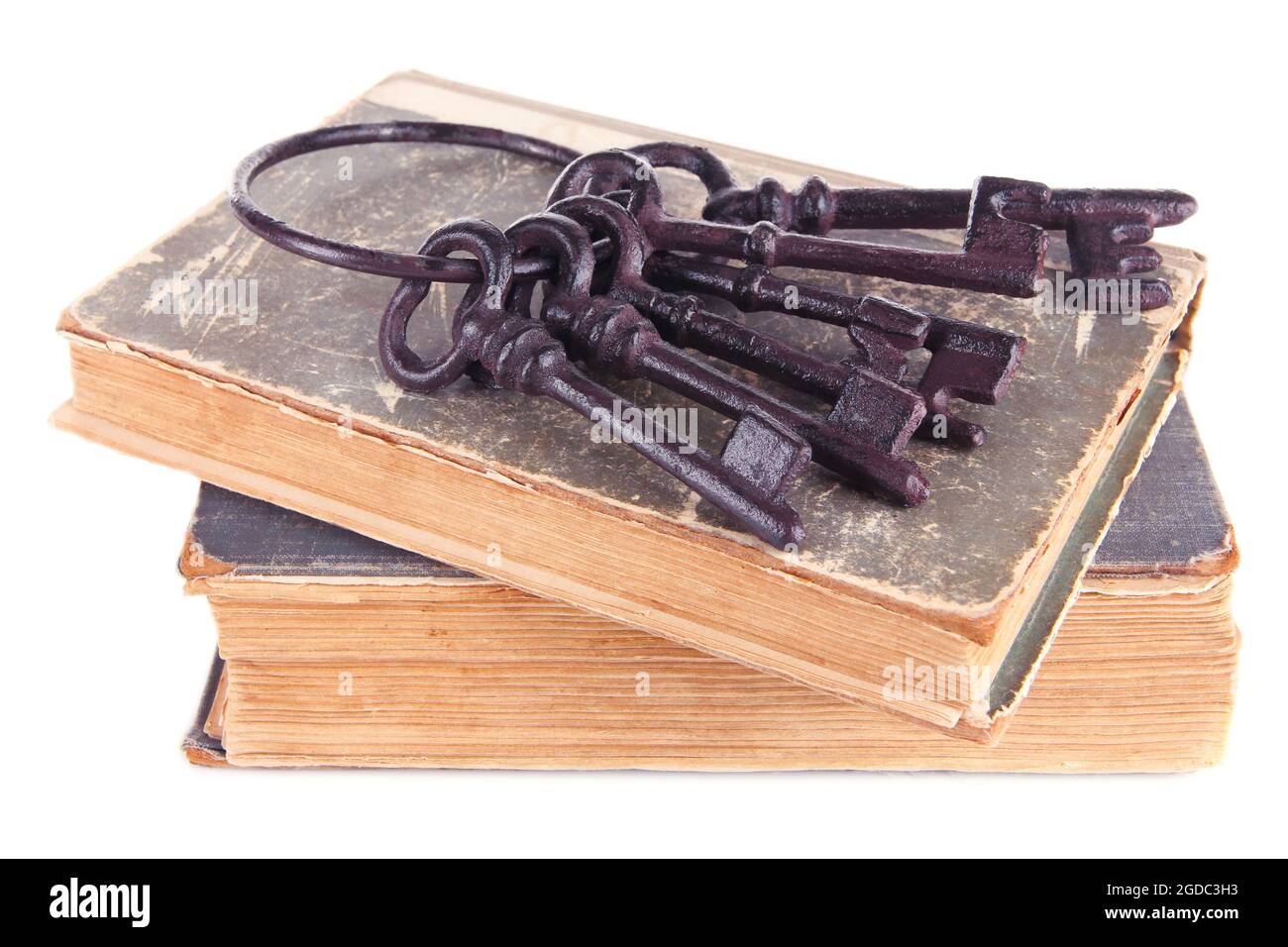Old keys on old books isolated on white Stock Photo - Alamy